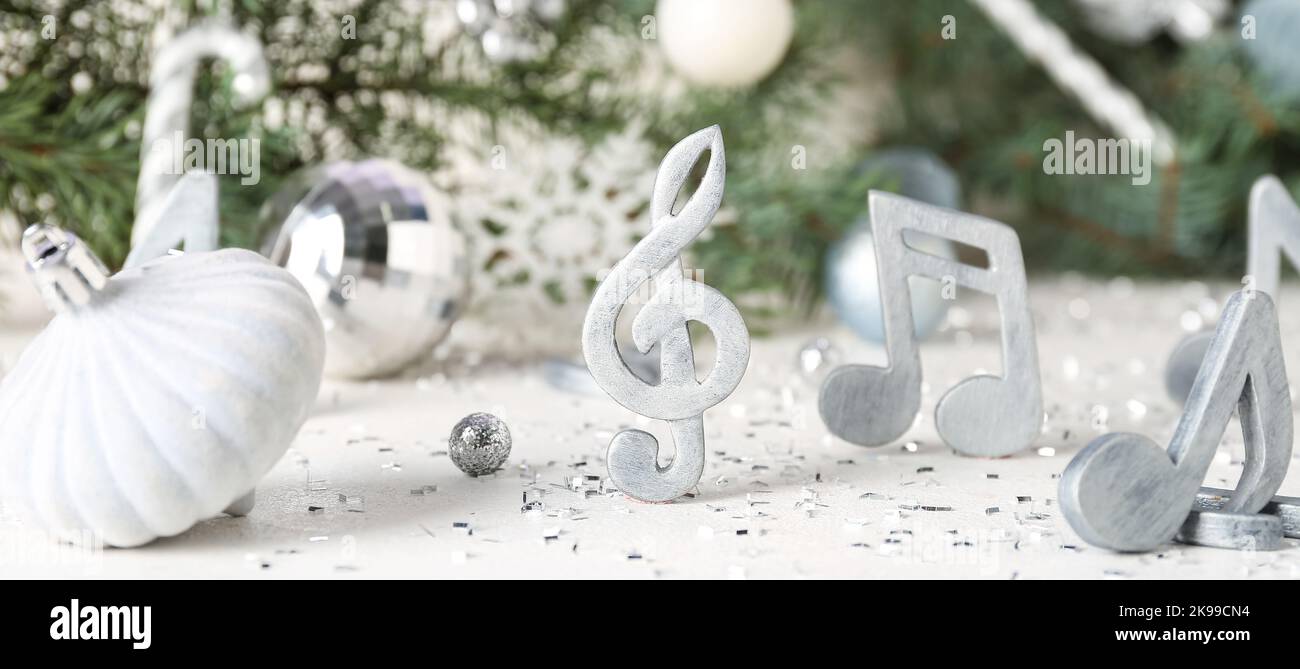 Music notes with Christmas decorations on light table Stock Photo - Alamy