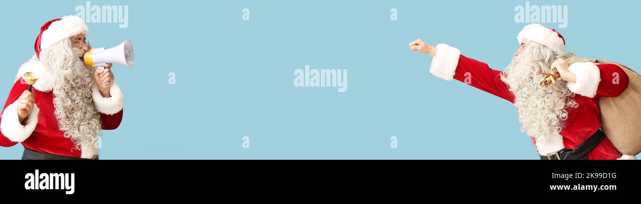 Banner with Santa Clauses on light blue background Stock Photo - Alamy