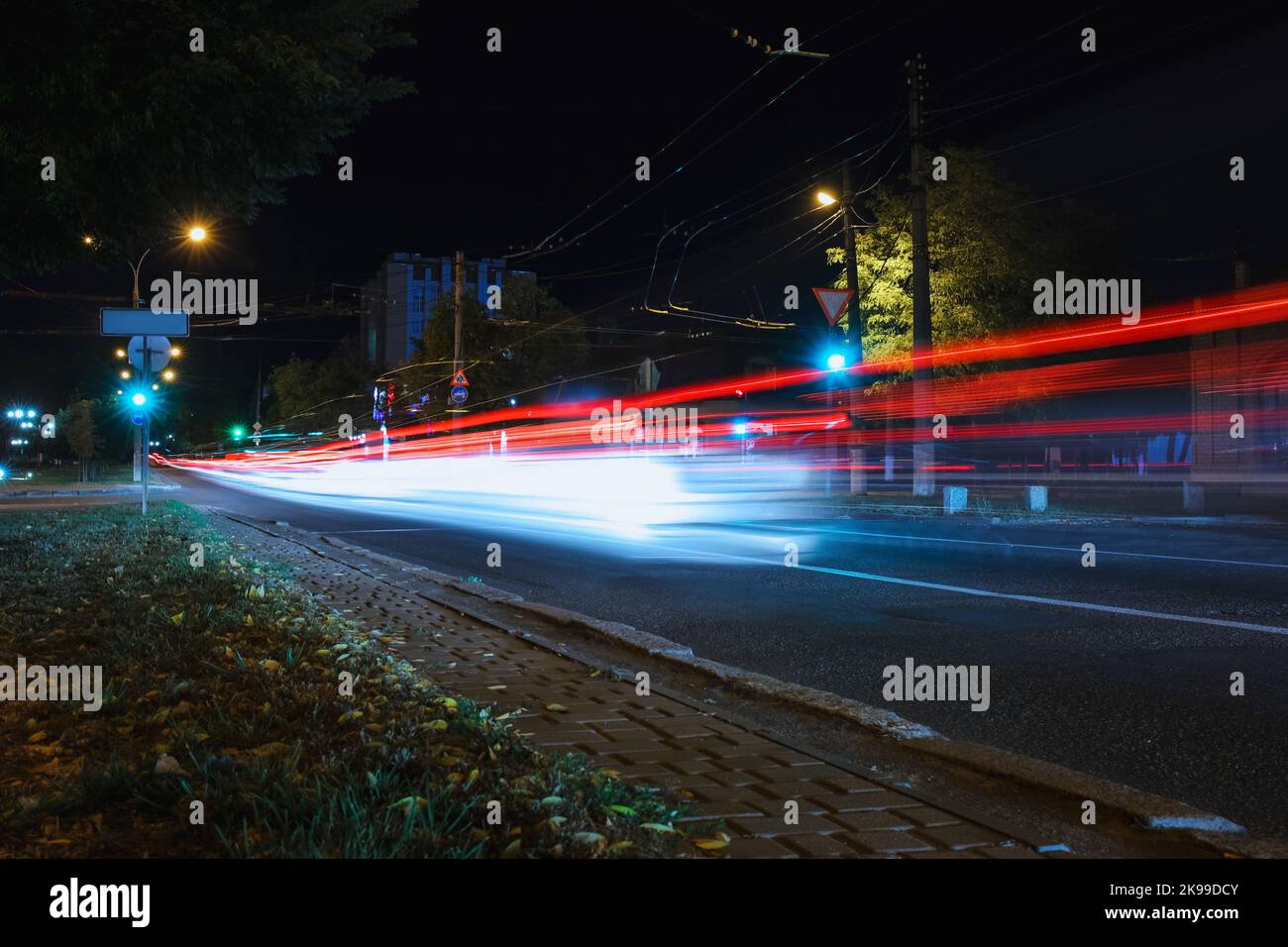 View of city road with street lights at night Stock Photo - Alamy