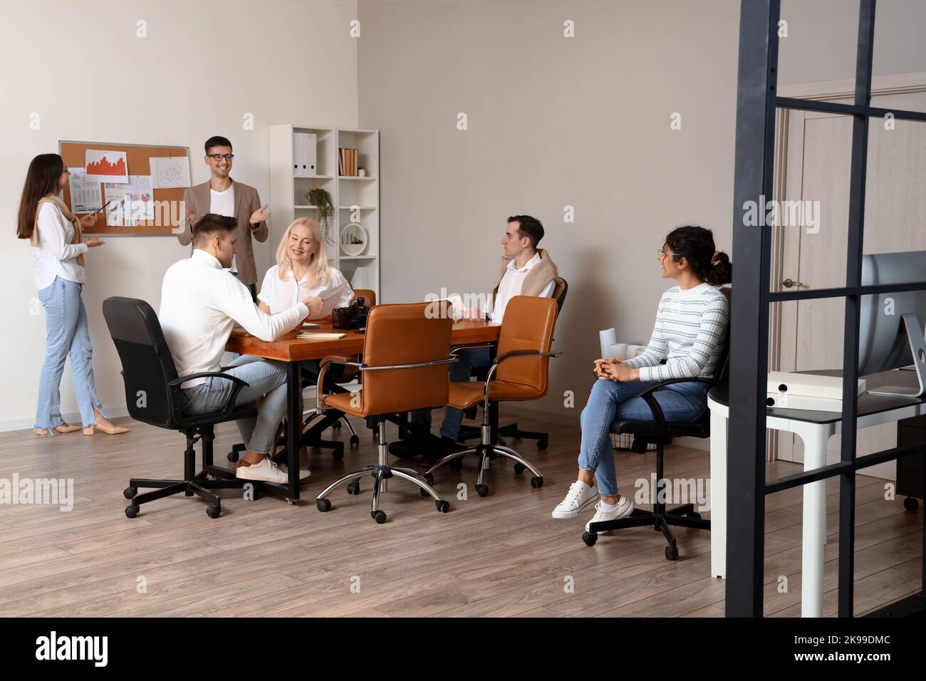 Businessman giving presentation co workers hi-res stock photography and ...