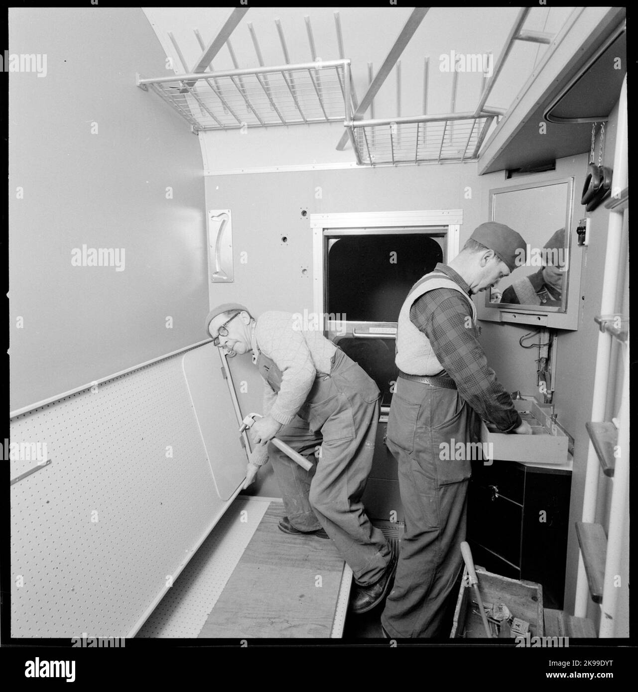 Mounting work in sleeping compartment Stock Photo - Alamy