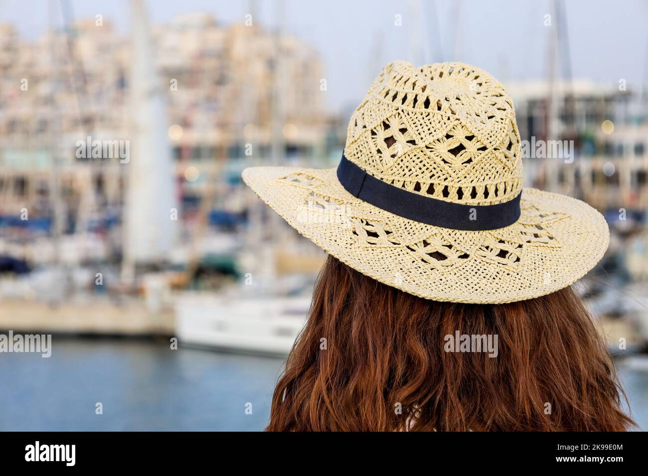 Woman back hat yachts hi-res stock photography and images - Alamy