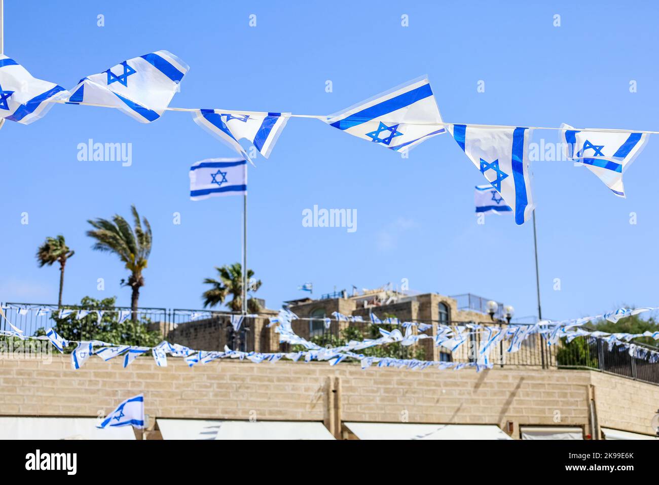 Flags of Israel hanging on city street Stock Photo - Alamy