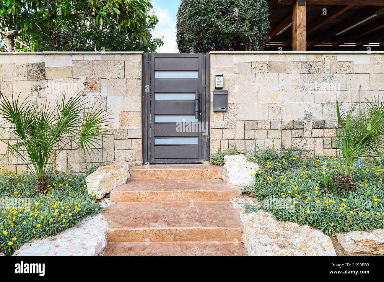View of fence with metal door, intercom and mailbox Stock Photo - Alamy