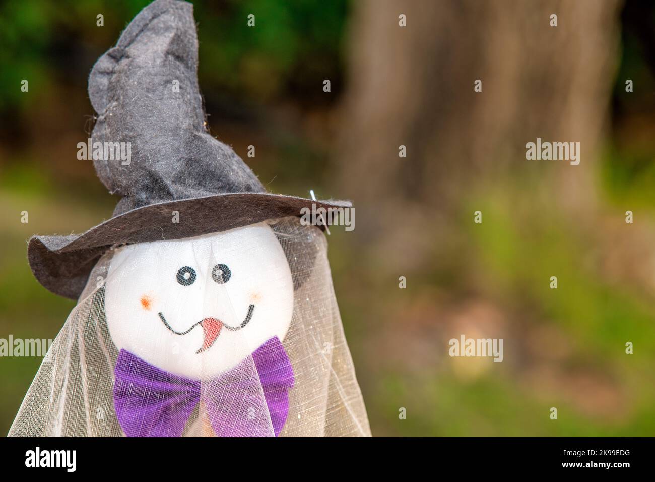 Puppet in wood and purple fabric with pumpkin-shaped face for halloween ...