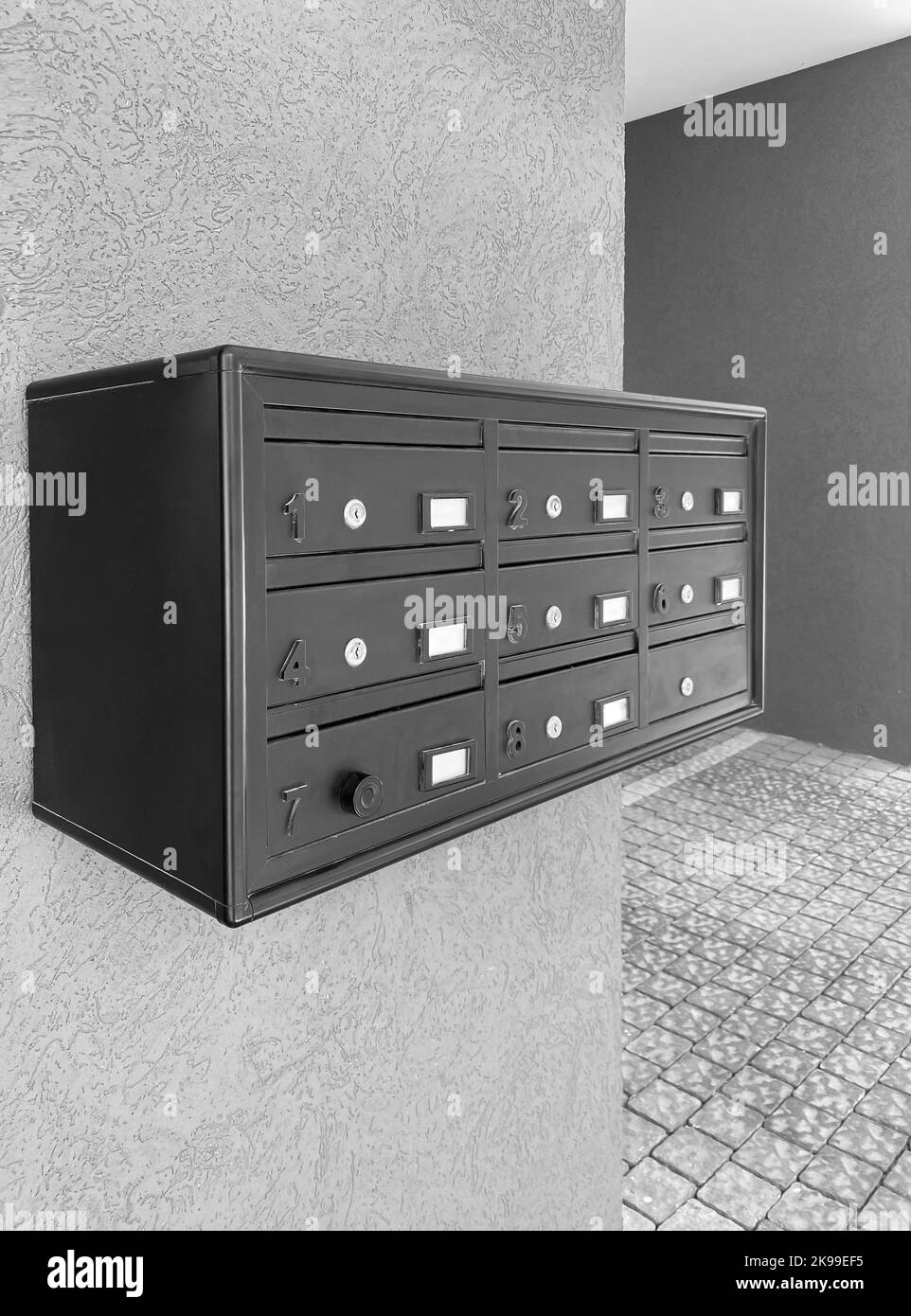 Modern mailboxes on grey wall in residential building Stock Photo - Alamy
