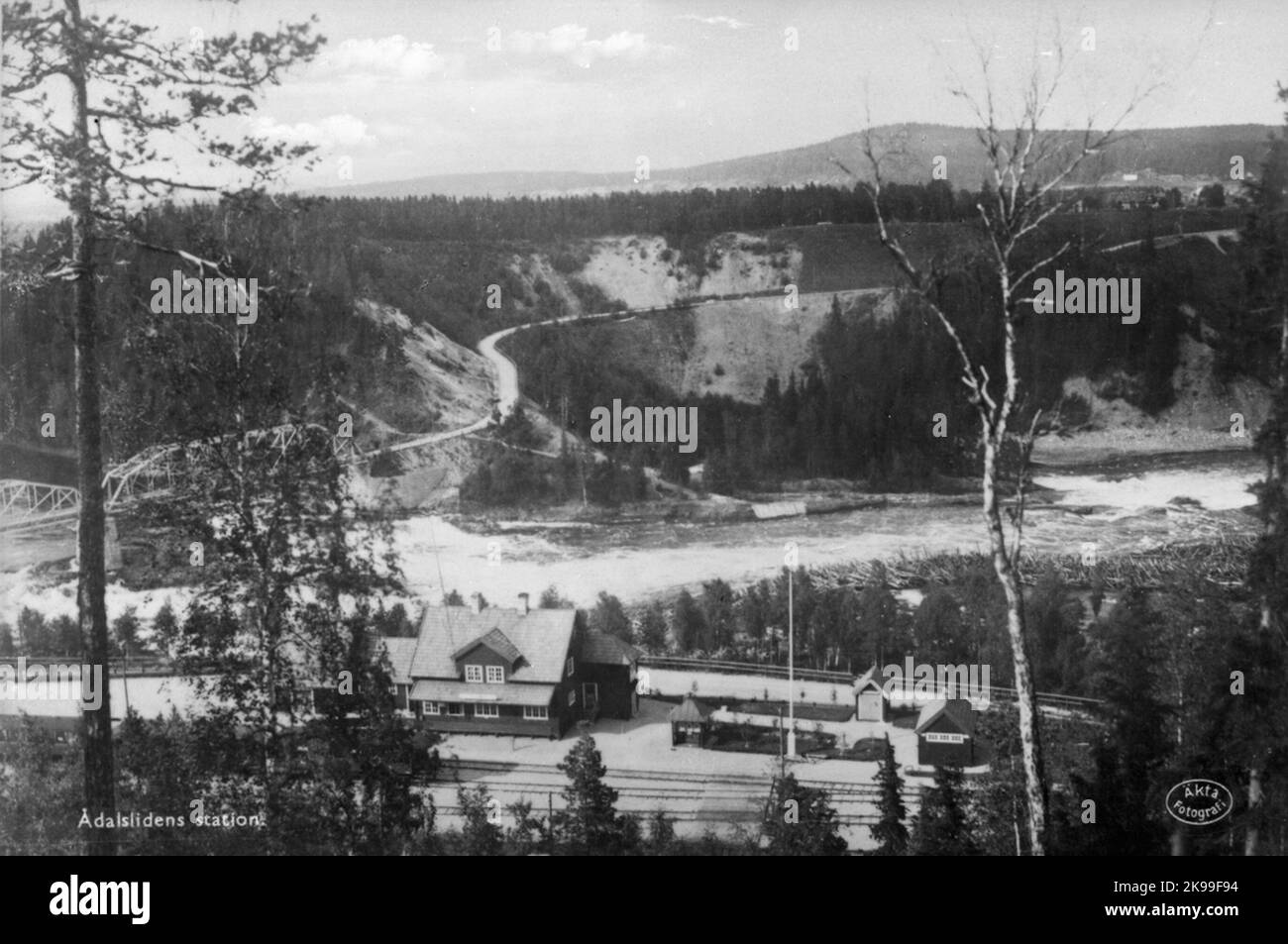 Ådalsliden station. Behind the station is Nämforsen, The Ångerman River ...