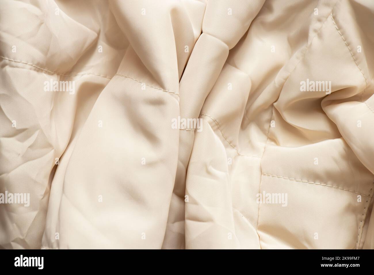 light beige wrinkled polyester fabric as background close-up Stock ...