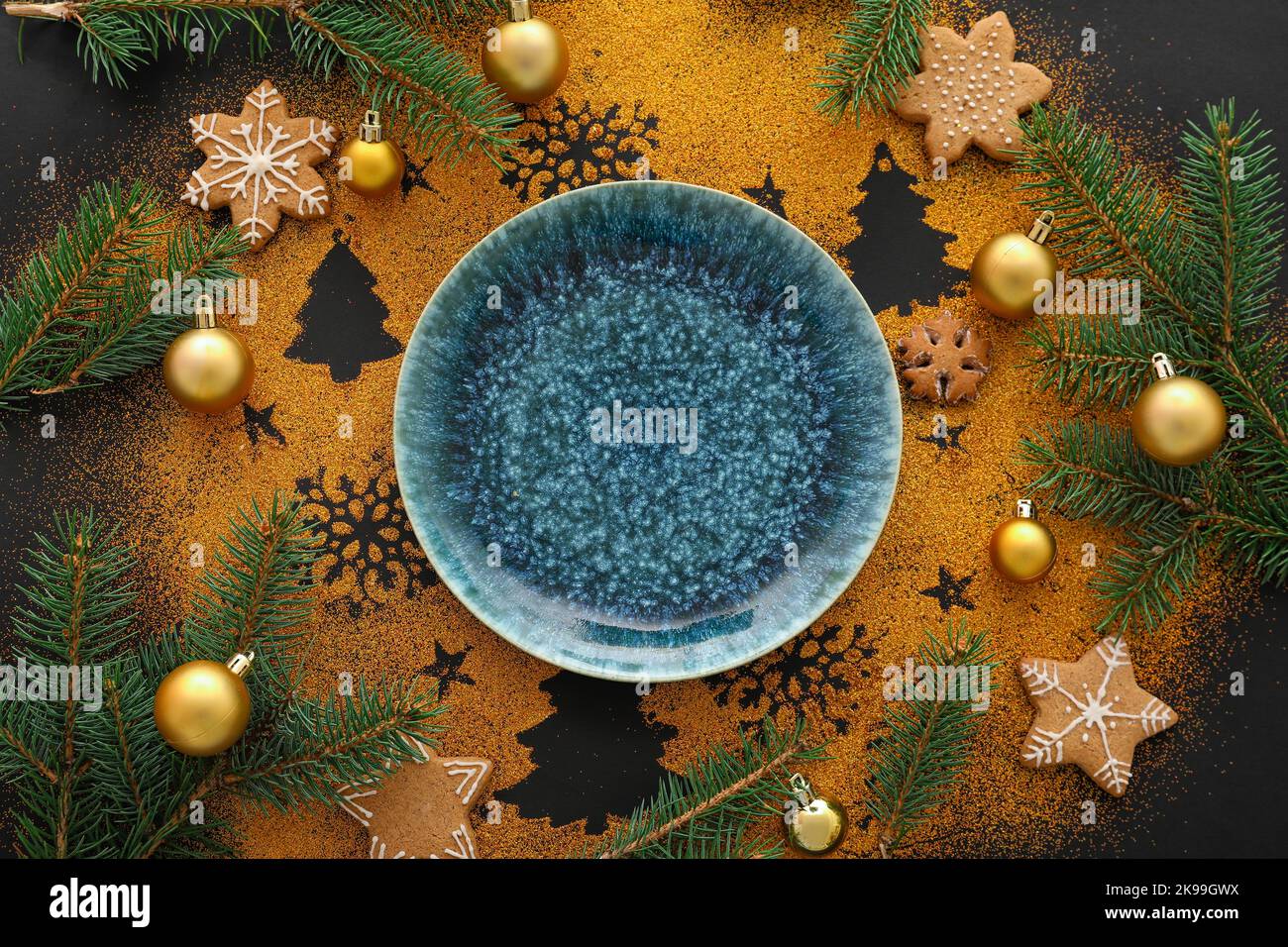 Composition with plate, fir branches, Christmas decorations and cookies ...