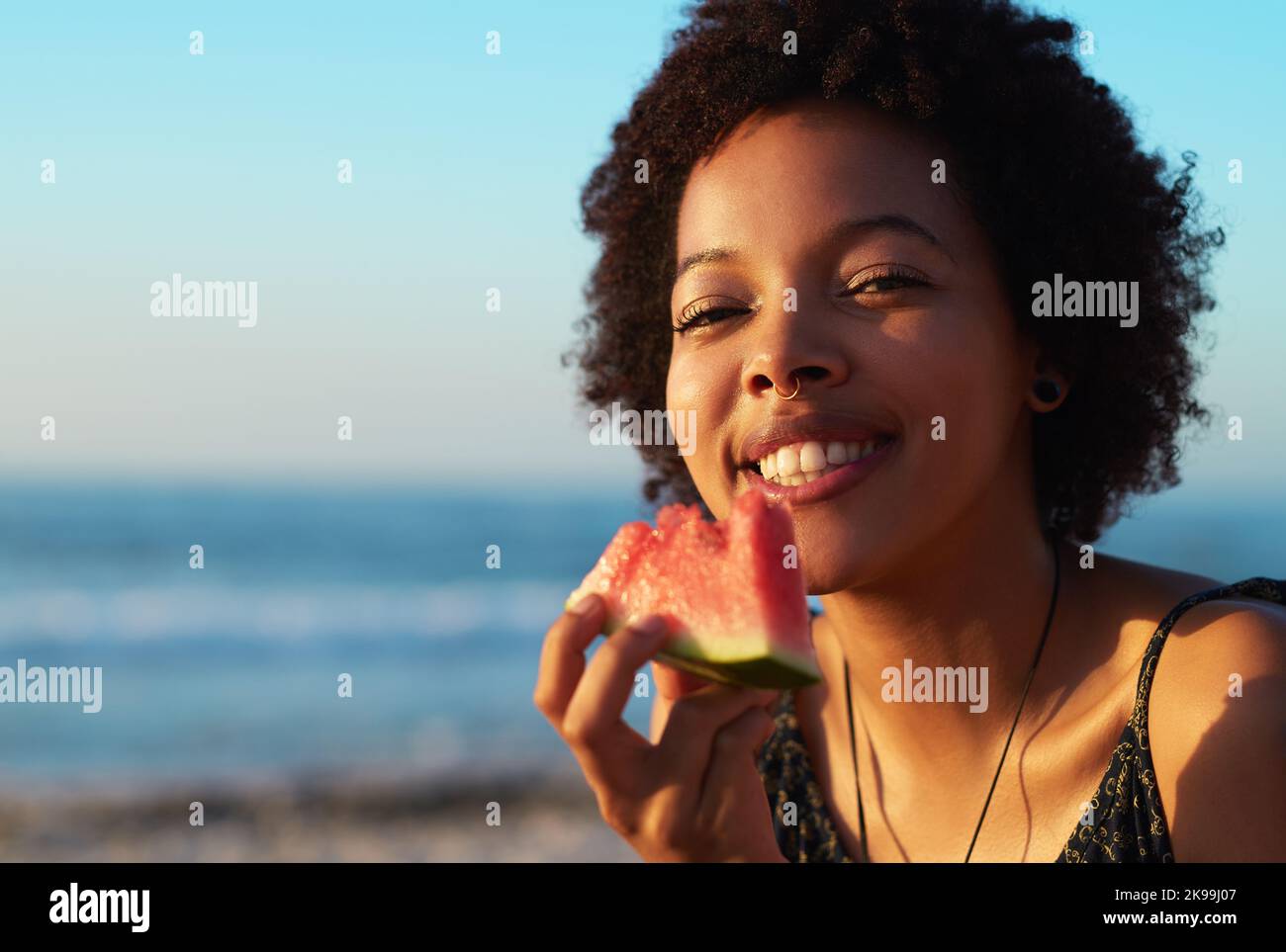 The best summer fruit for days like these. Portrait of an attractive ...