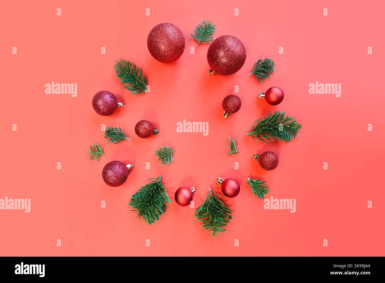 Round fir frame with red glitter balls on red background. Cosmetics ...