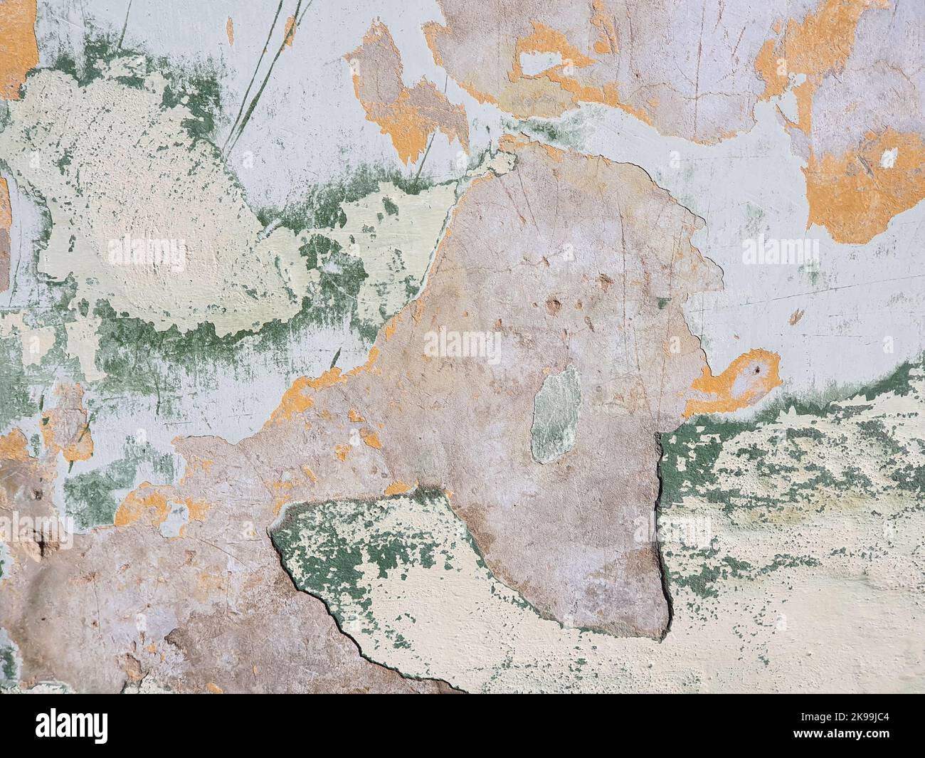 Multi Colored layers of old plaster. Texture of rough cracked pink ...