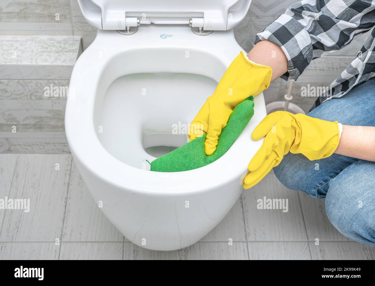 cleaning wc. Housekeeper, cleaning man at toilet. Brush up Toilet for ...