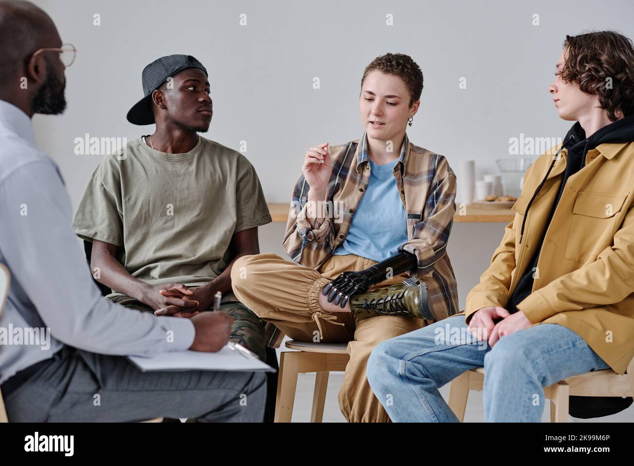 Girl with disability discussing her mental condition with ...