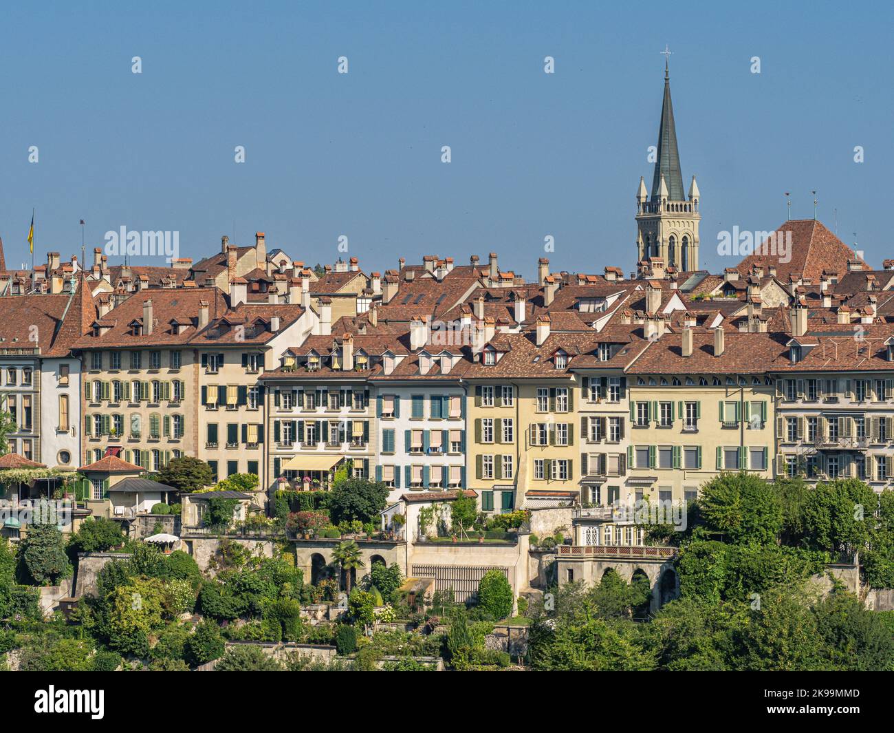 An aerial view of historic buildings under a blue sky in Bern ...