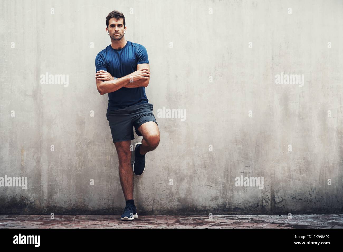 Work hard so you can show off your rewards. Portrait of a sporty young ...