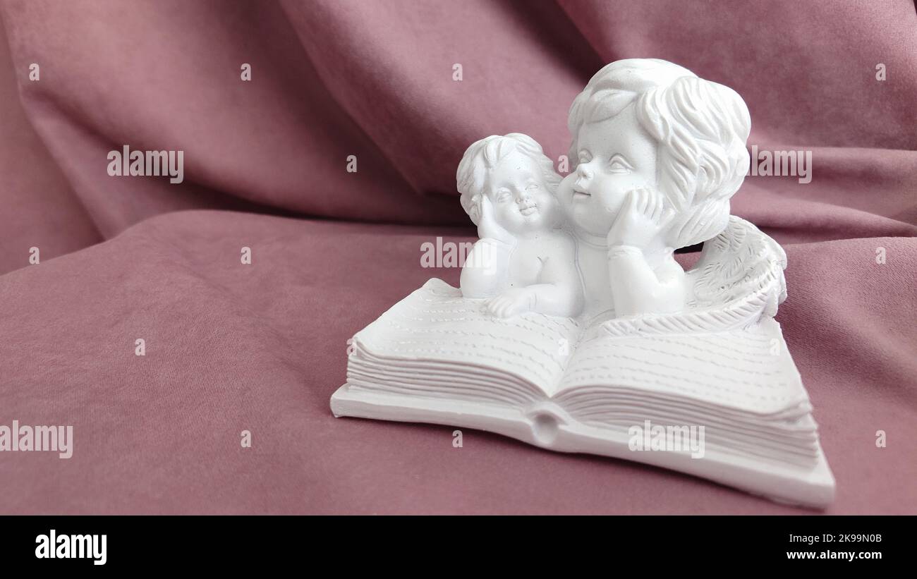 Two angels with prayer book hi-res stock photography and images - Alamy