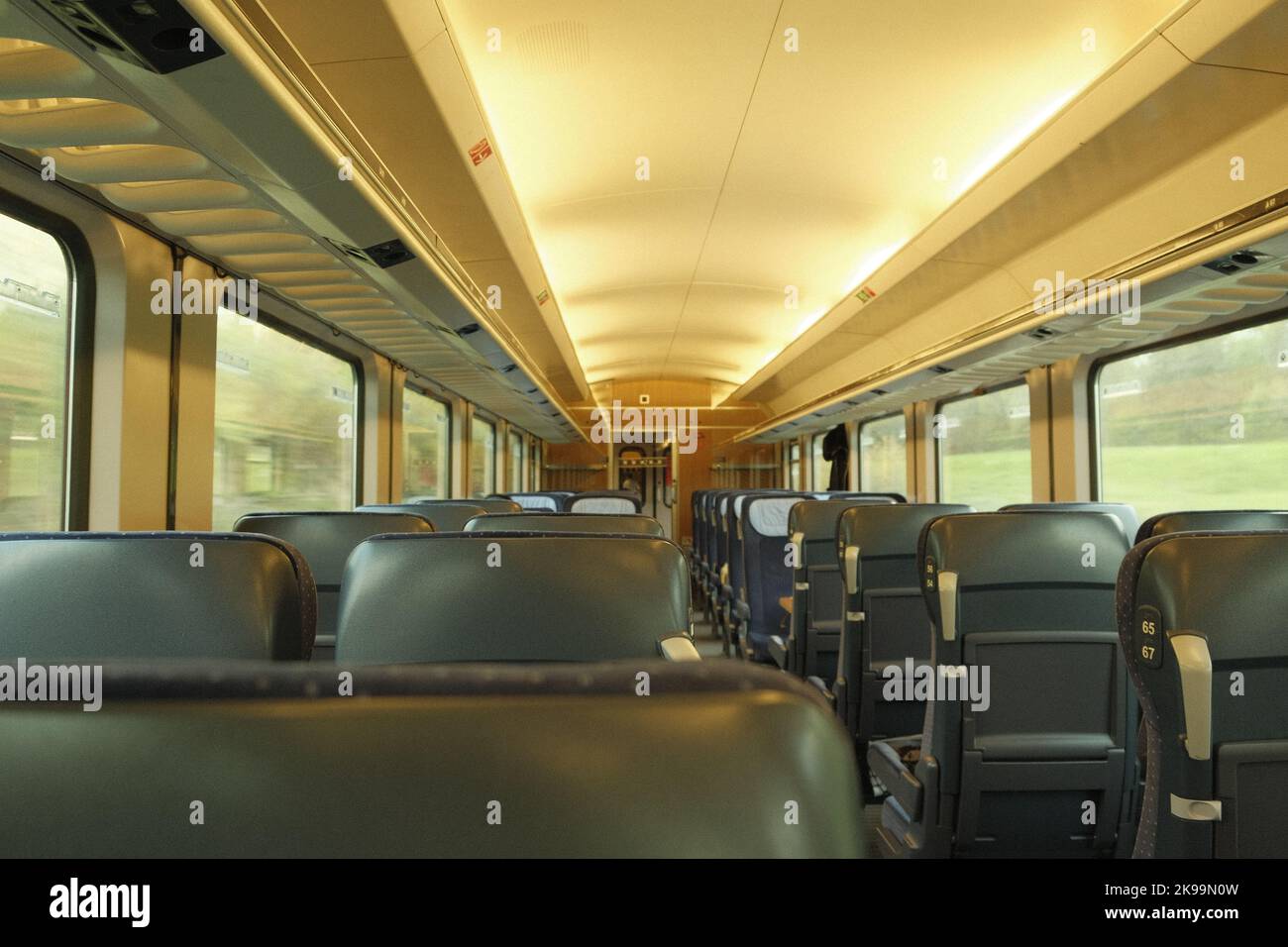 The interior of a train illuminated with lights and leather seats Stock ...