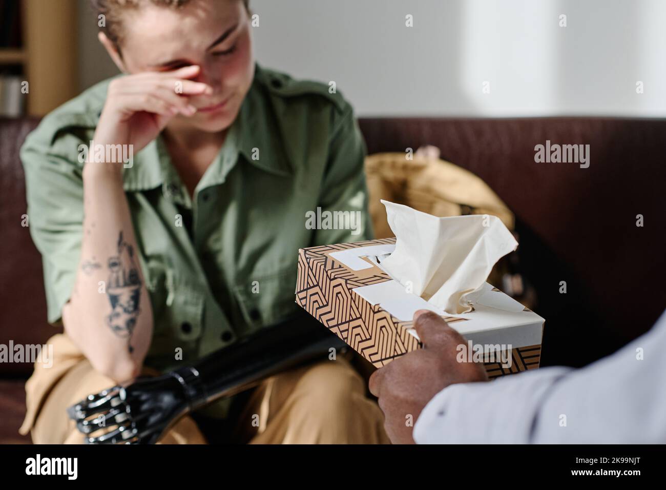 Young woman with disability crying at psychology session while ...