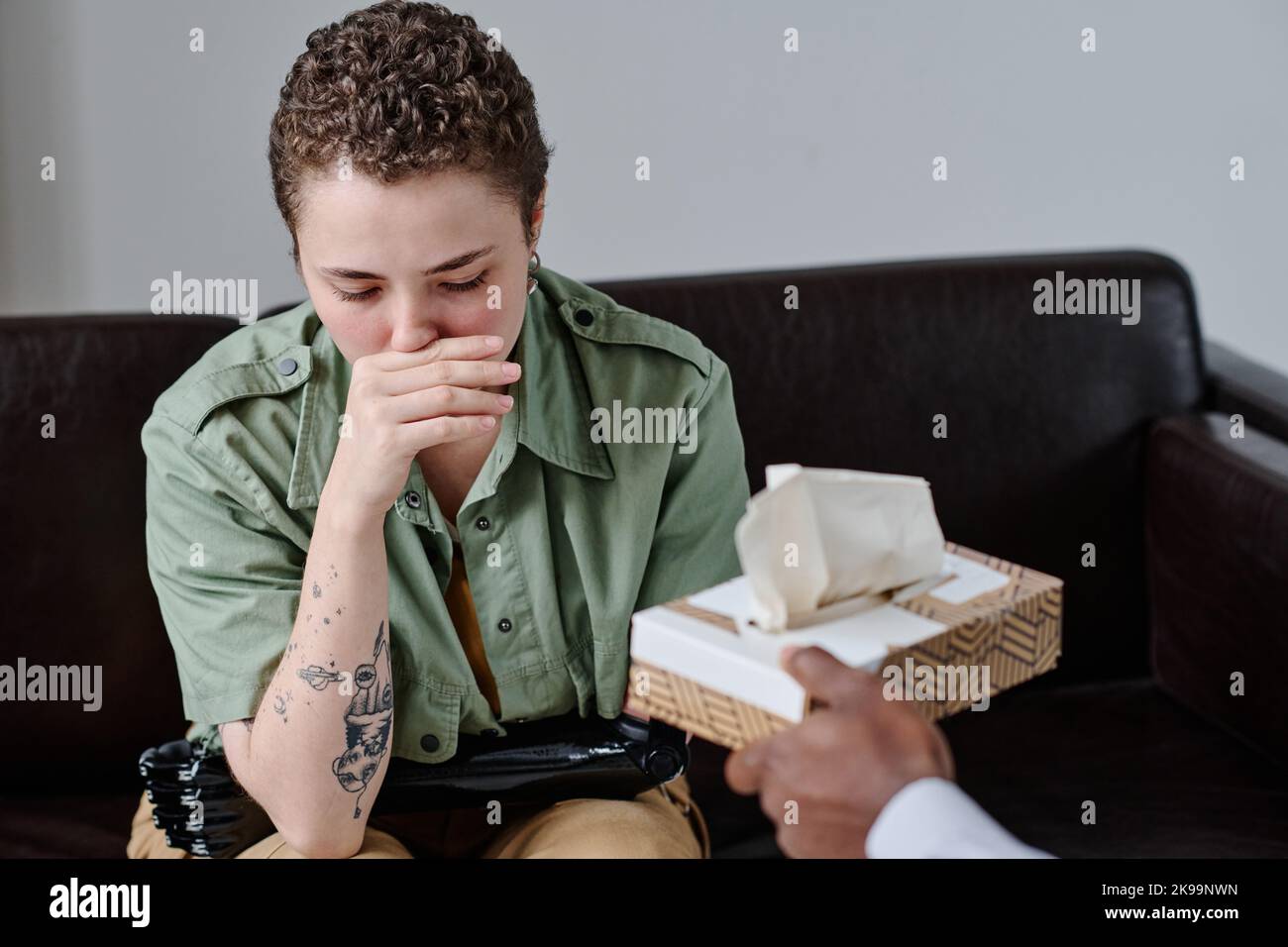 Girl with disability crying during psychotherapy session while sitting ...
