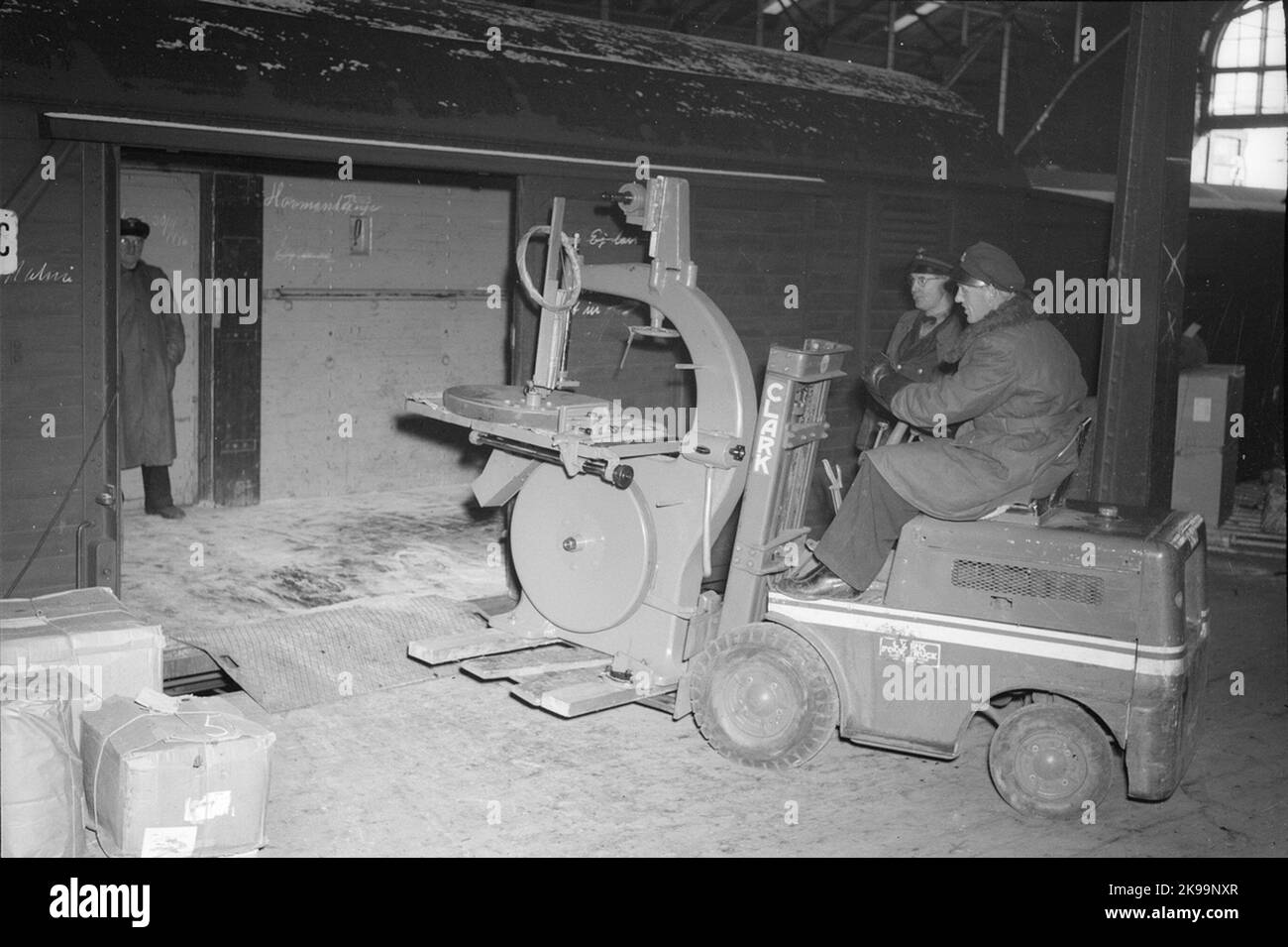 Shipping items in Malmö. Work machine on pallet runs with forklift ...