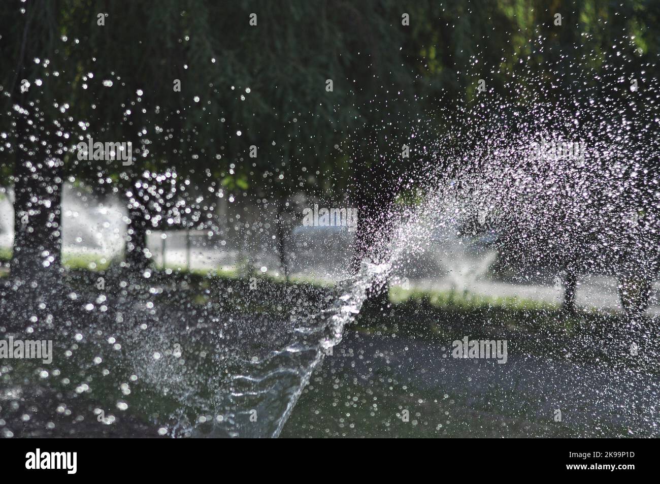 The splashing water stream in the air Stock Photo - Alamy
