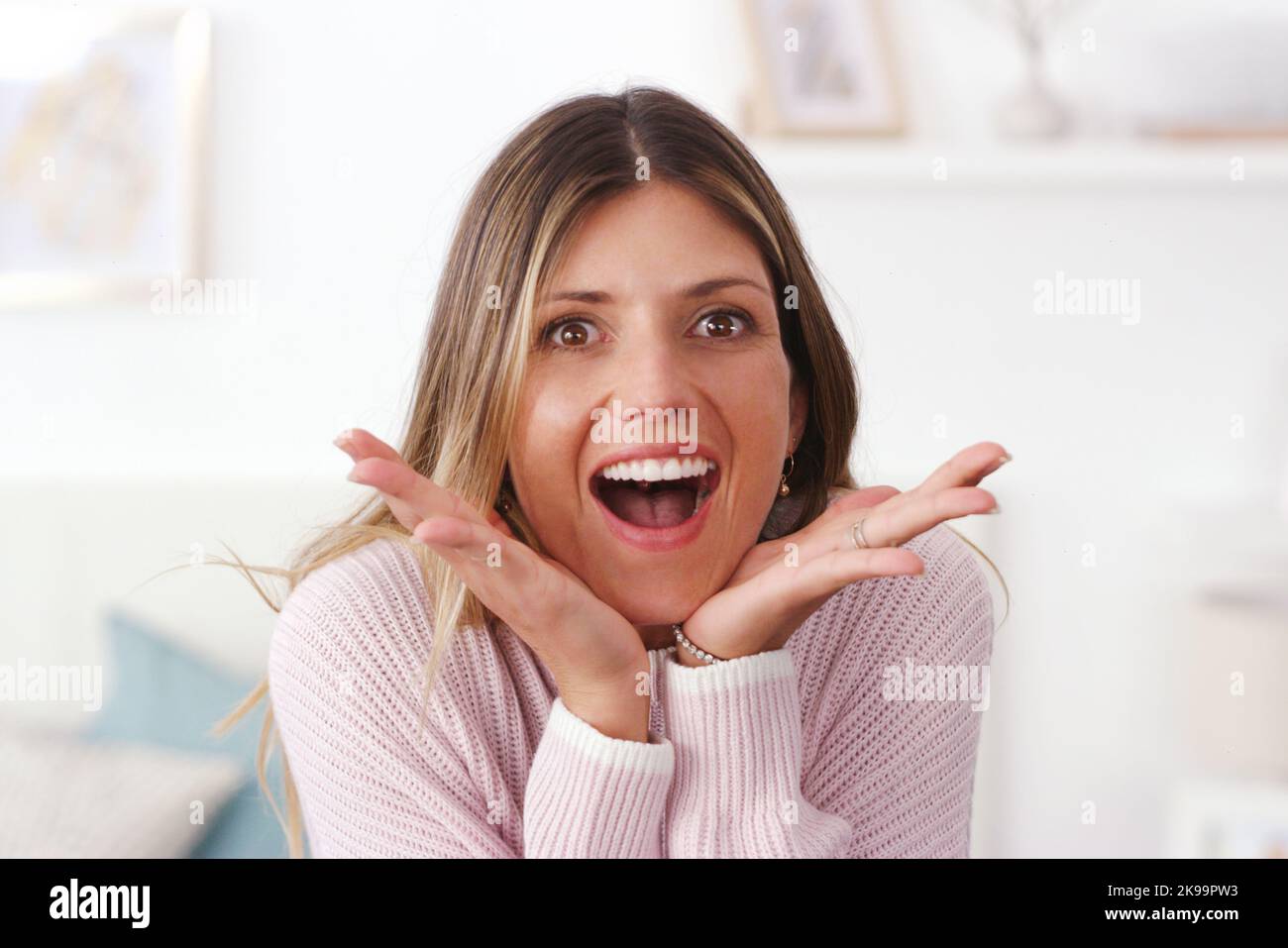 I just love surprises. a woman looking surprised Stock Photo - Alamy
