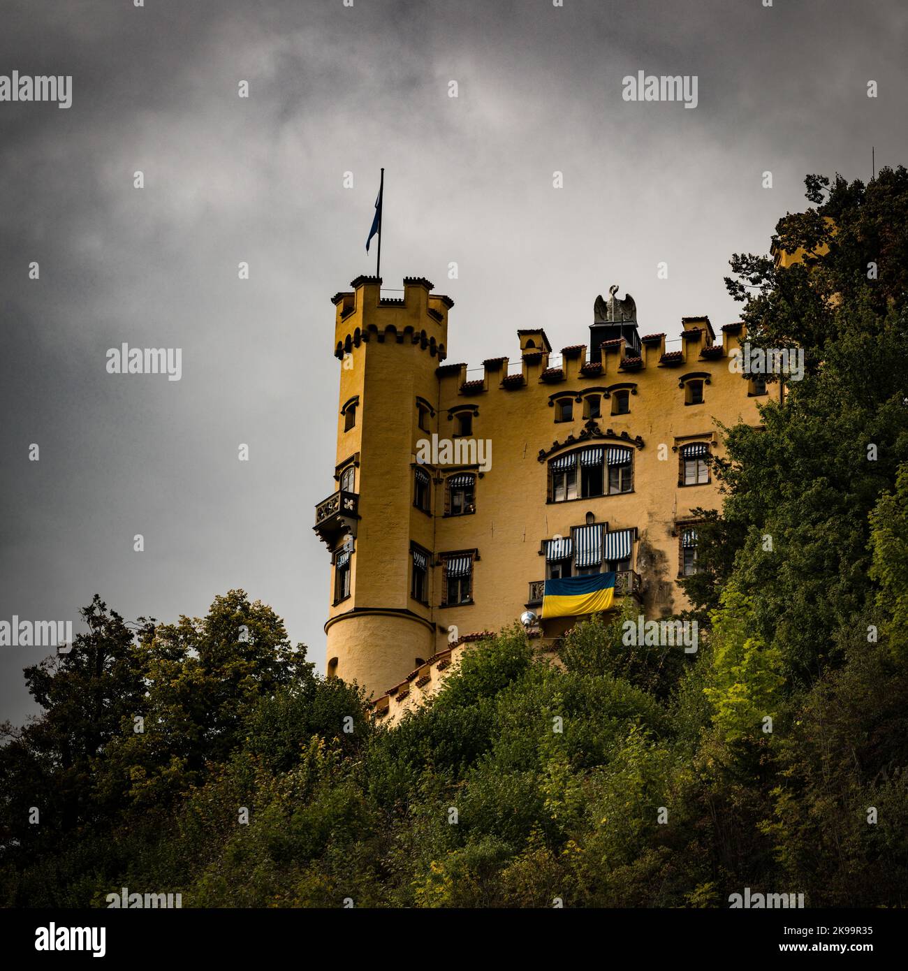 A low angle shot of a historic yellow stone castle in Neuschwanstein ...