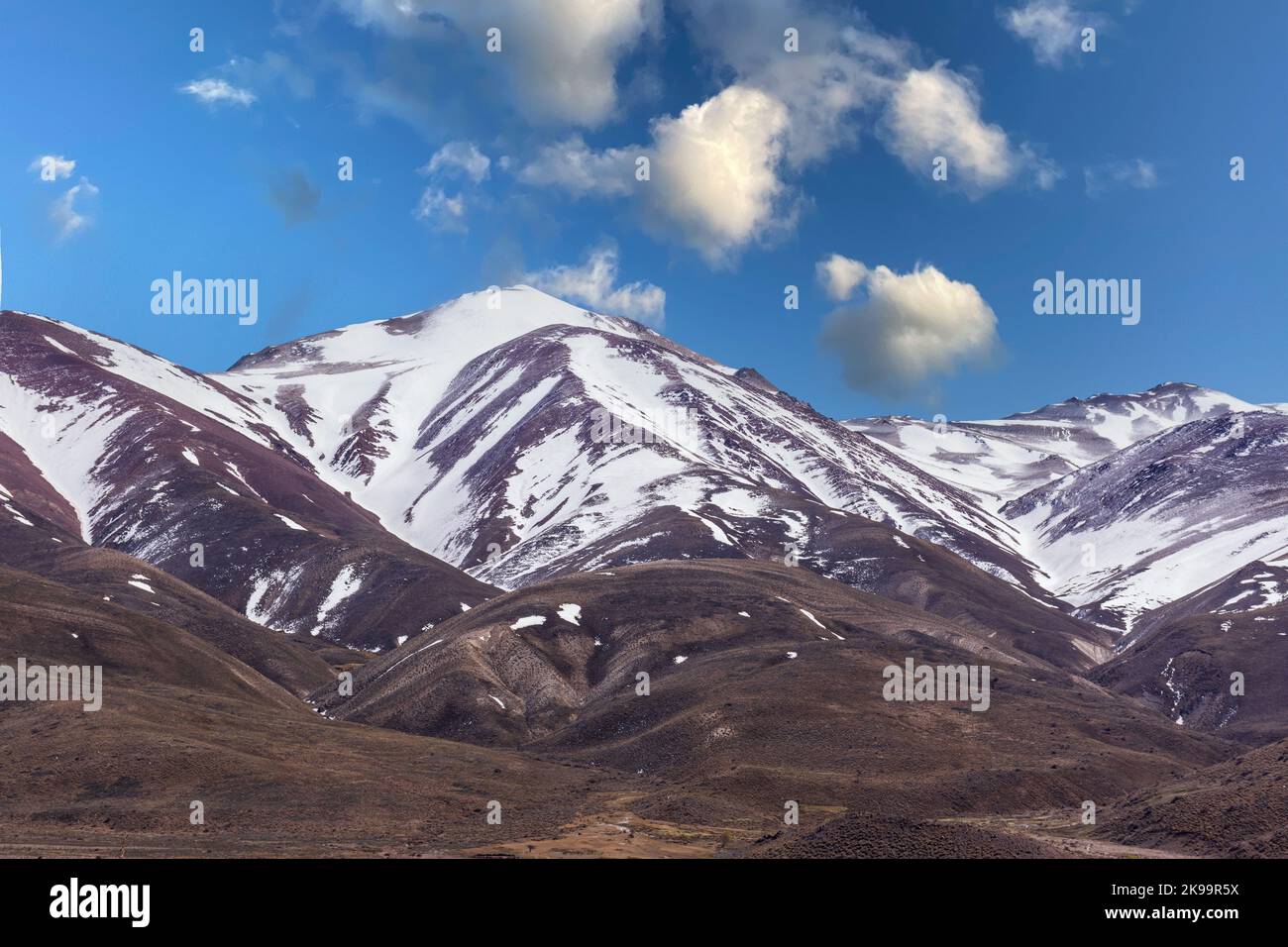 A scenic shot of the Andes mountains covered in snow captured in ...