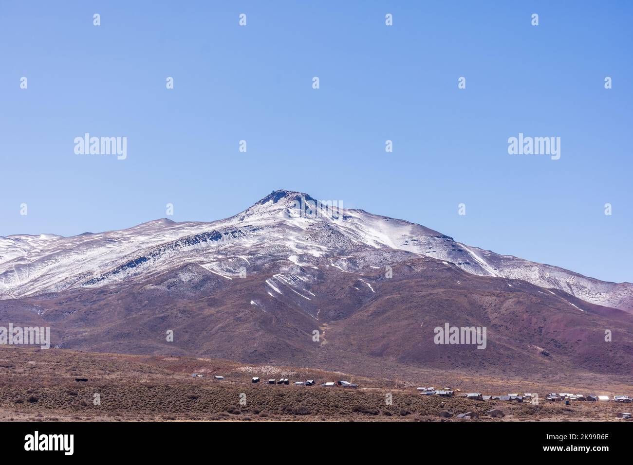 A scenic shot of the Andes mountains covered in snow captured in ...