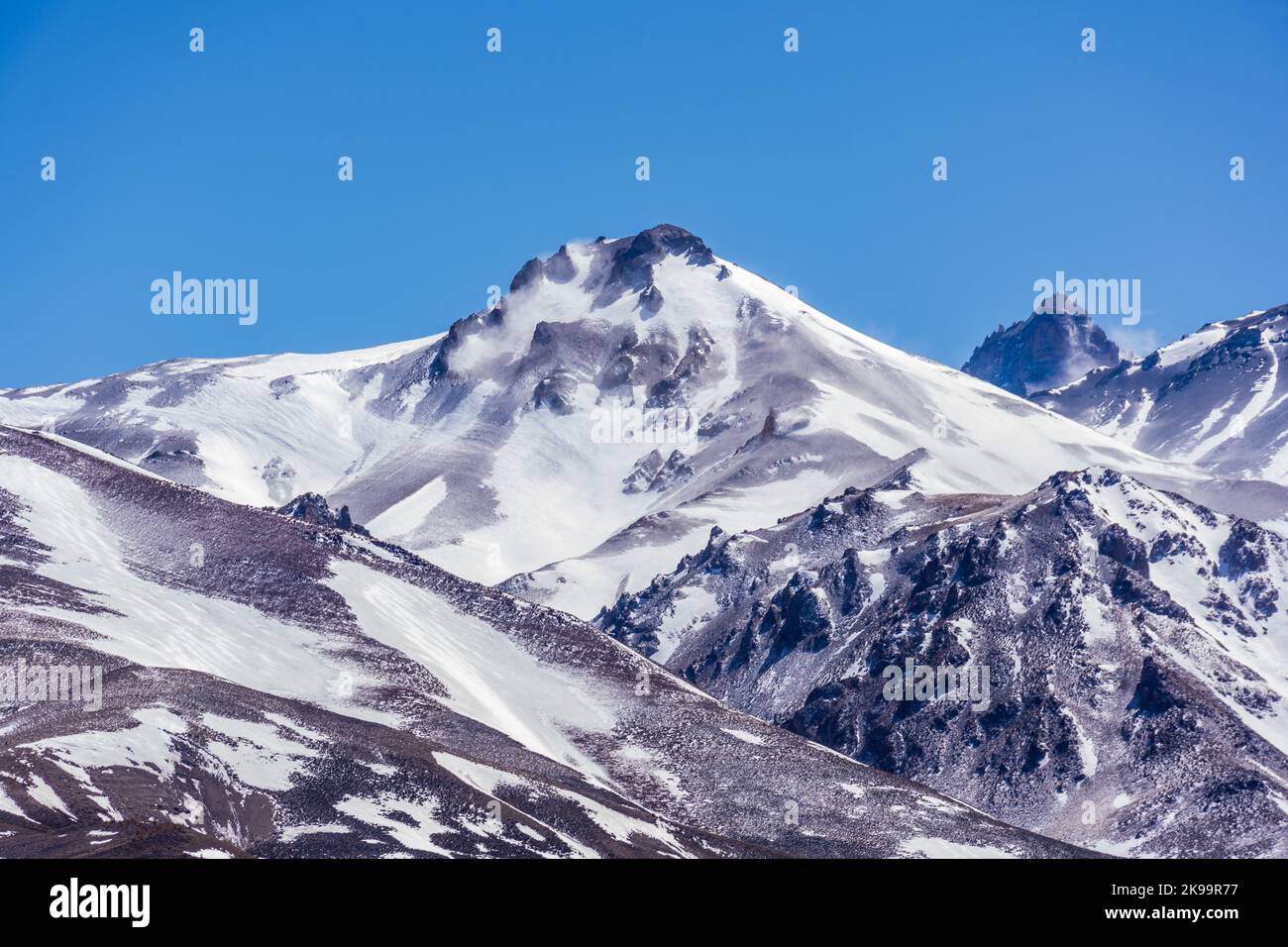 A scenic shot of the Andes mountains covered in snow captured in ...