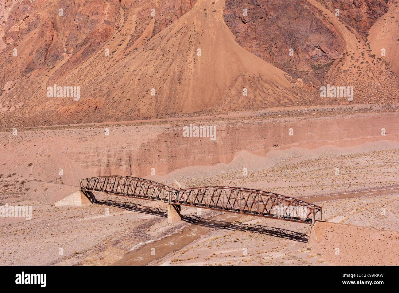 An old bridge over a river in the Andes mountain range, Mendoza ...