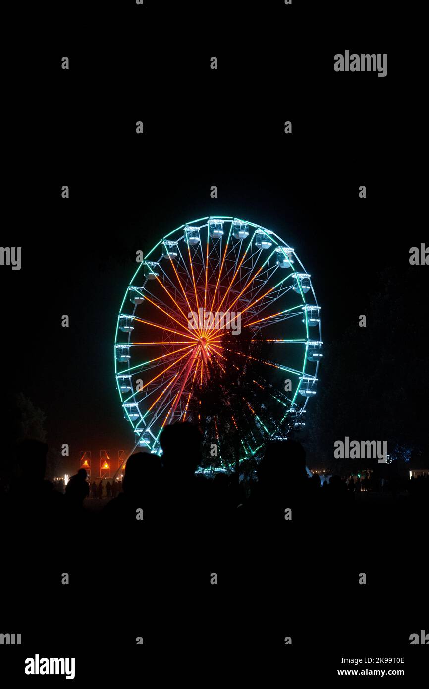 A vertical shot of the Ferris wheel at the Electric Castle Festival at ...