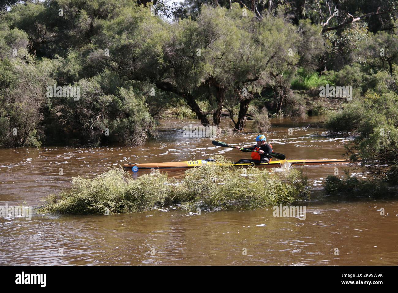 A protected competitor driving a boat on a river Stock Photo - Alamy