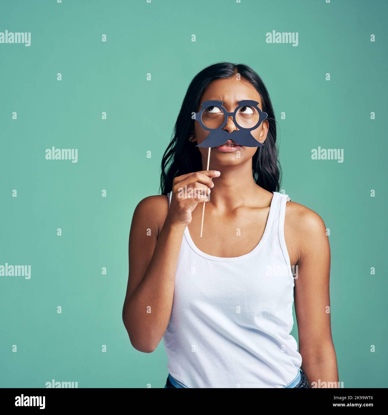 What do guys think about. Studio shot of a beautiful young woman posing ...