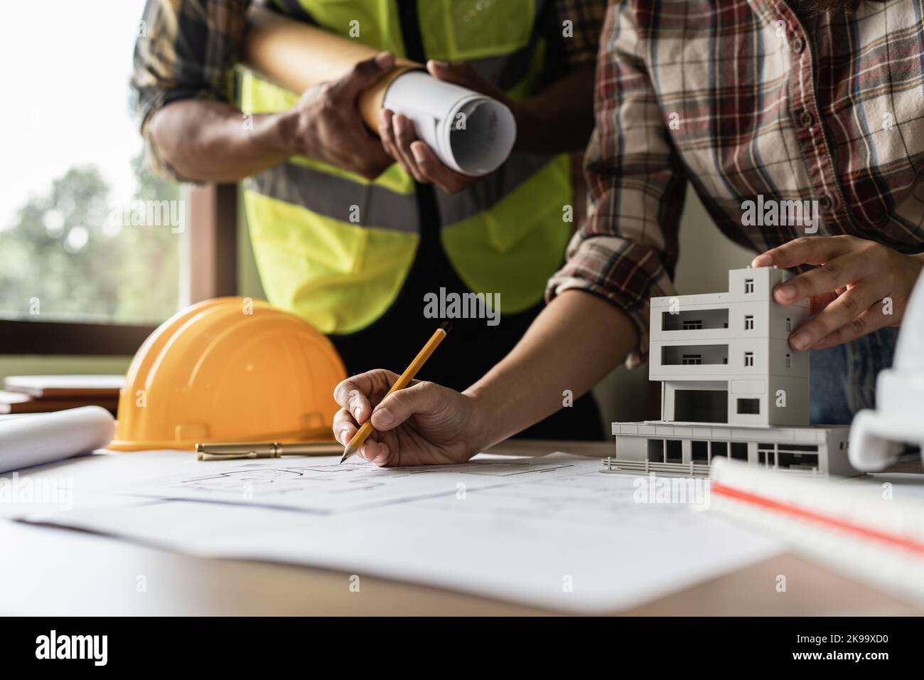 Architect man working with blueprints for architectural plan, engineer ...