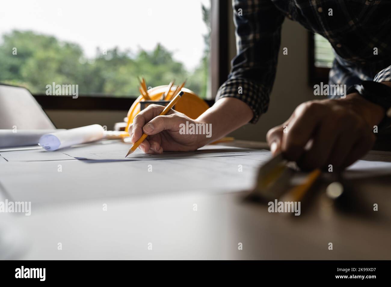 Architect man working with blueprints for architectural plan, engineer ...