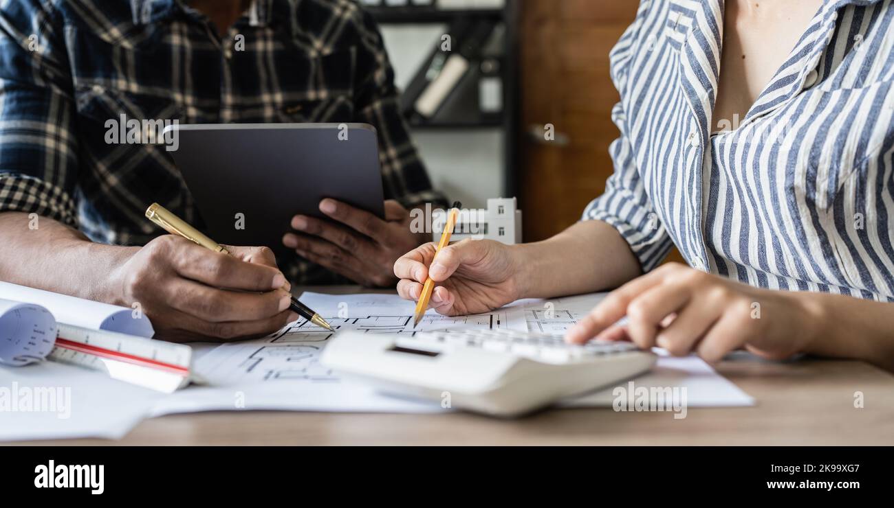 Architect man working with blueprints for architectural plan, engineer ...