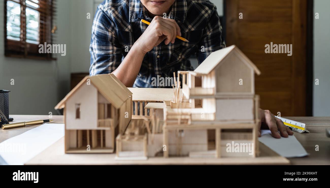 Architect man working with blueprints for architectural plan, engineer ...