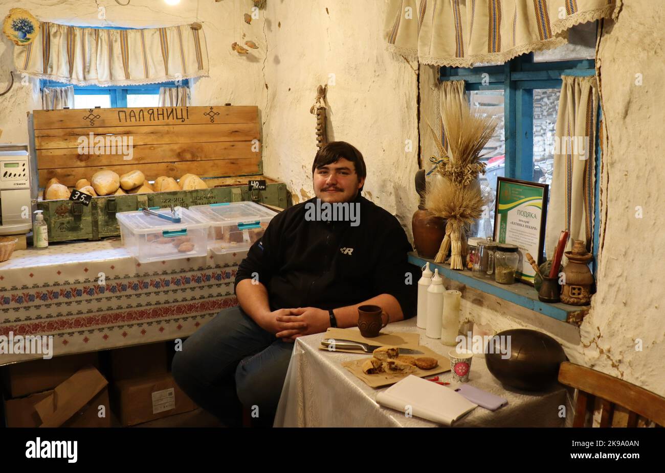Butscha, Ukraine. 21st Oct, 2022. The baker Yaroslav Burkivsky sits in ...