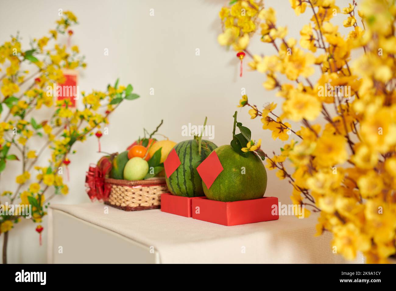 Fresh fruits and blooming apricot branches for Tet celebration Stock ...