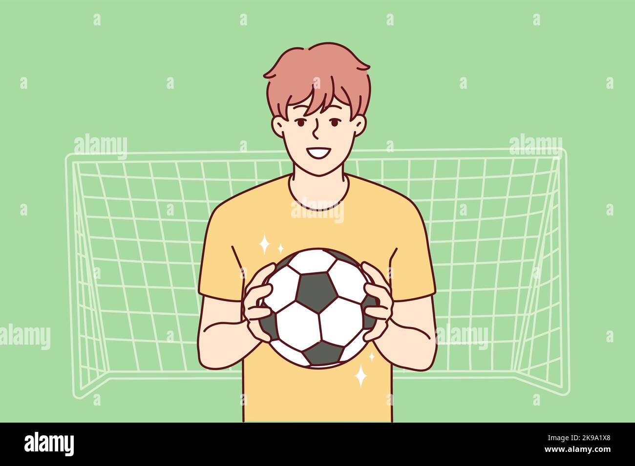 Smiling guy with ball stand near gates playing football. Happy male ...