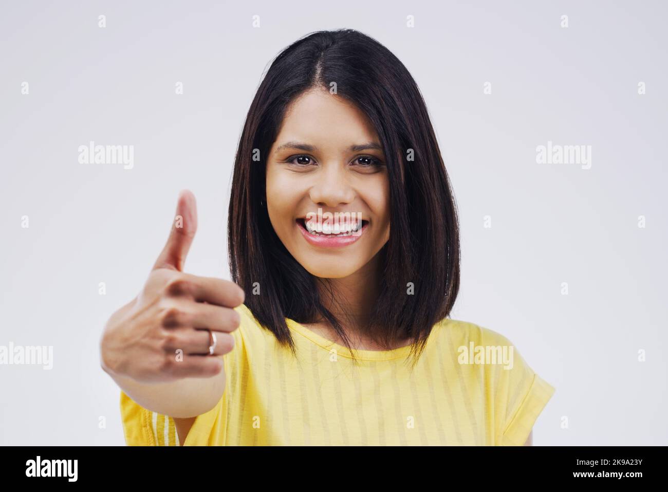 I definitely agree. Studio portrait of an attractive young woman giving ...
