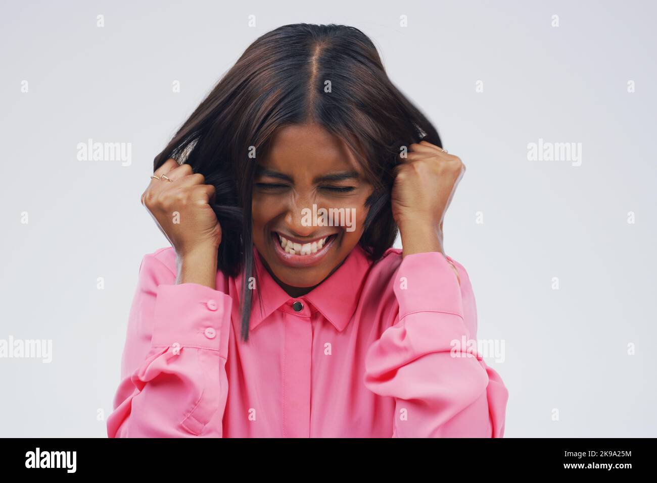 The stress is real. Studio shot of an attractive young woman looking ...