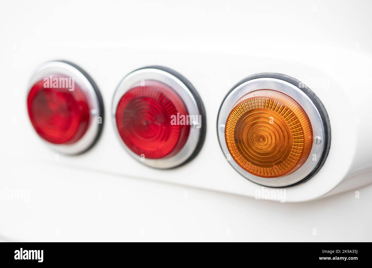 Retro style turn indicator lights in red and orange color Stock Photo ...