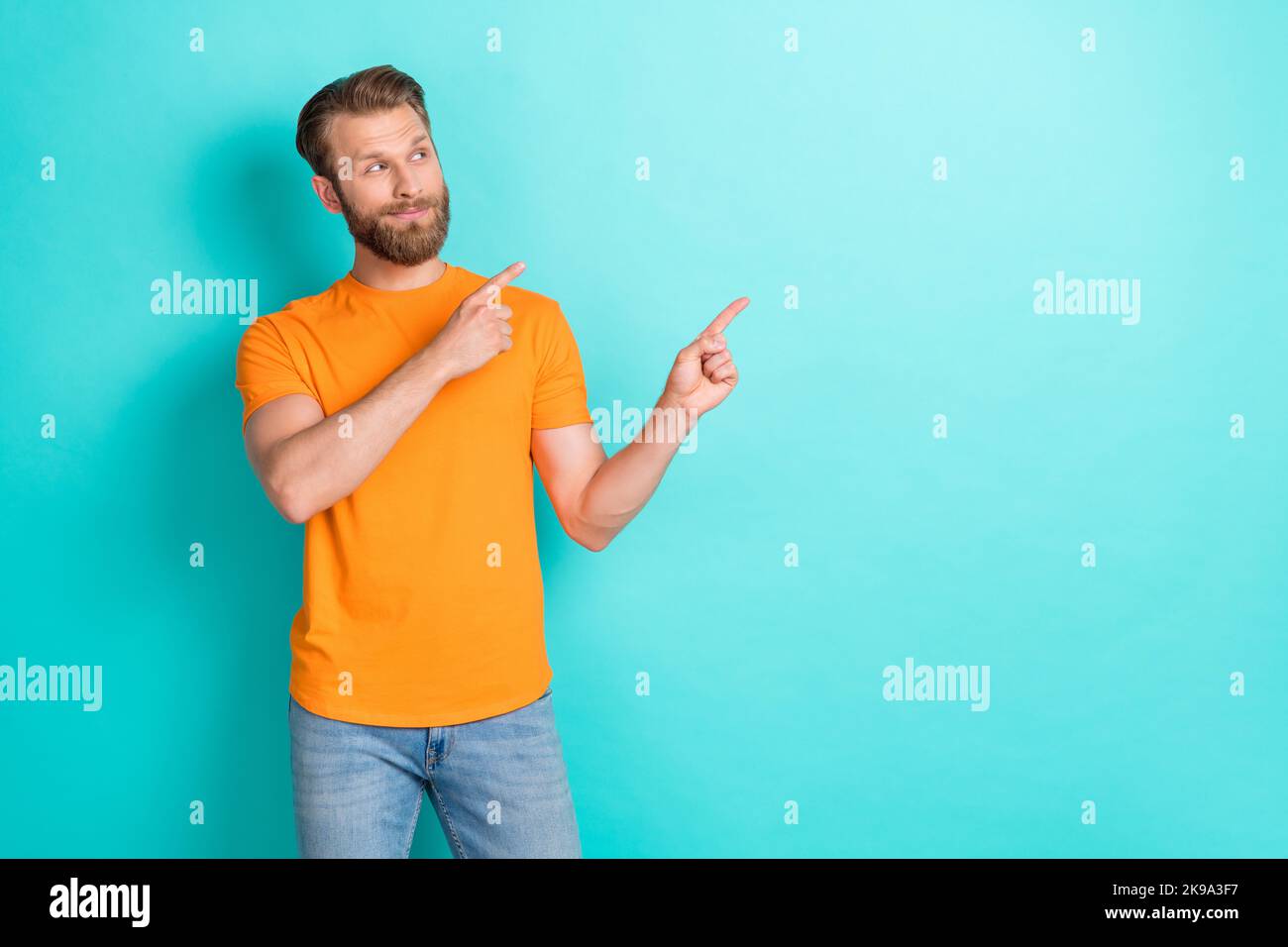 Photo Of Nice Brown Hairdo Guy Look Promo Wear Orange T Shirt Isolated