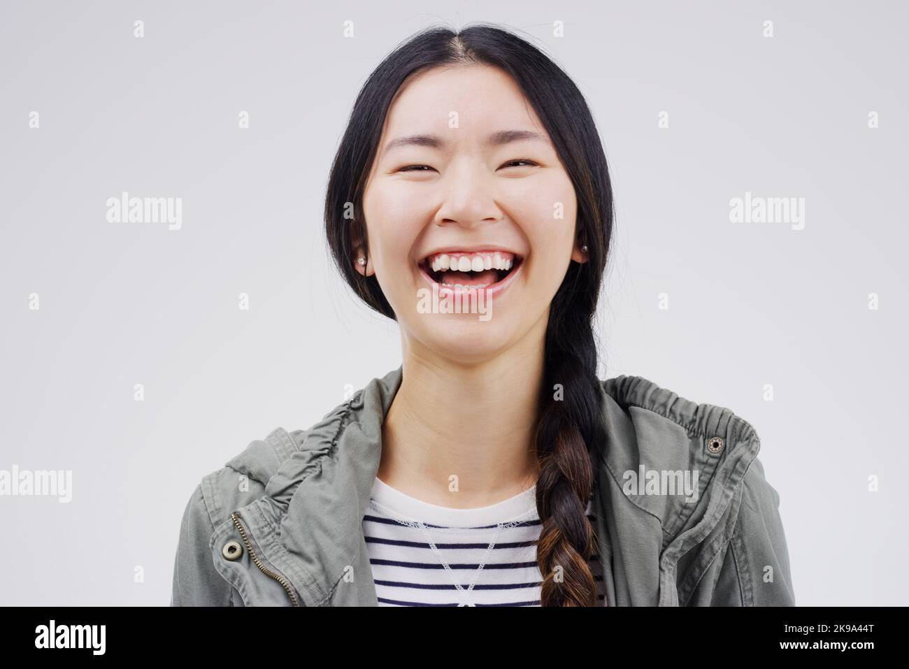 Thats hilarious. Studio portrait of an attractive young woman laughing ...