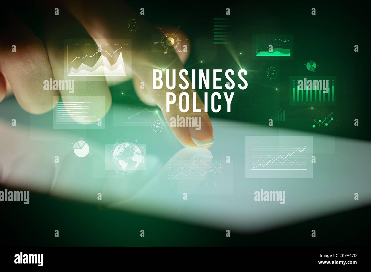 Finger touching tablet with business graphs and icons concept Stock ...