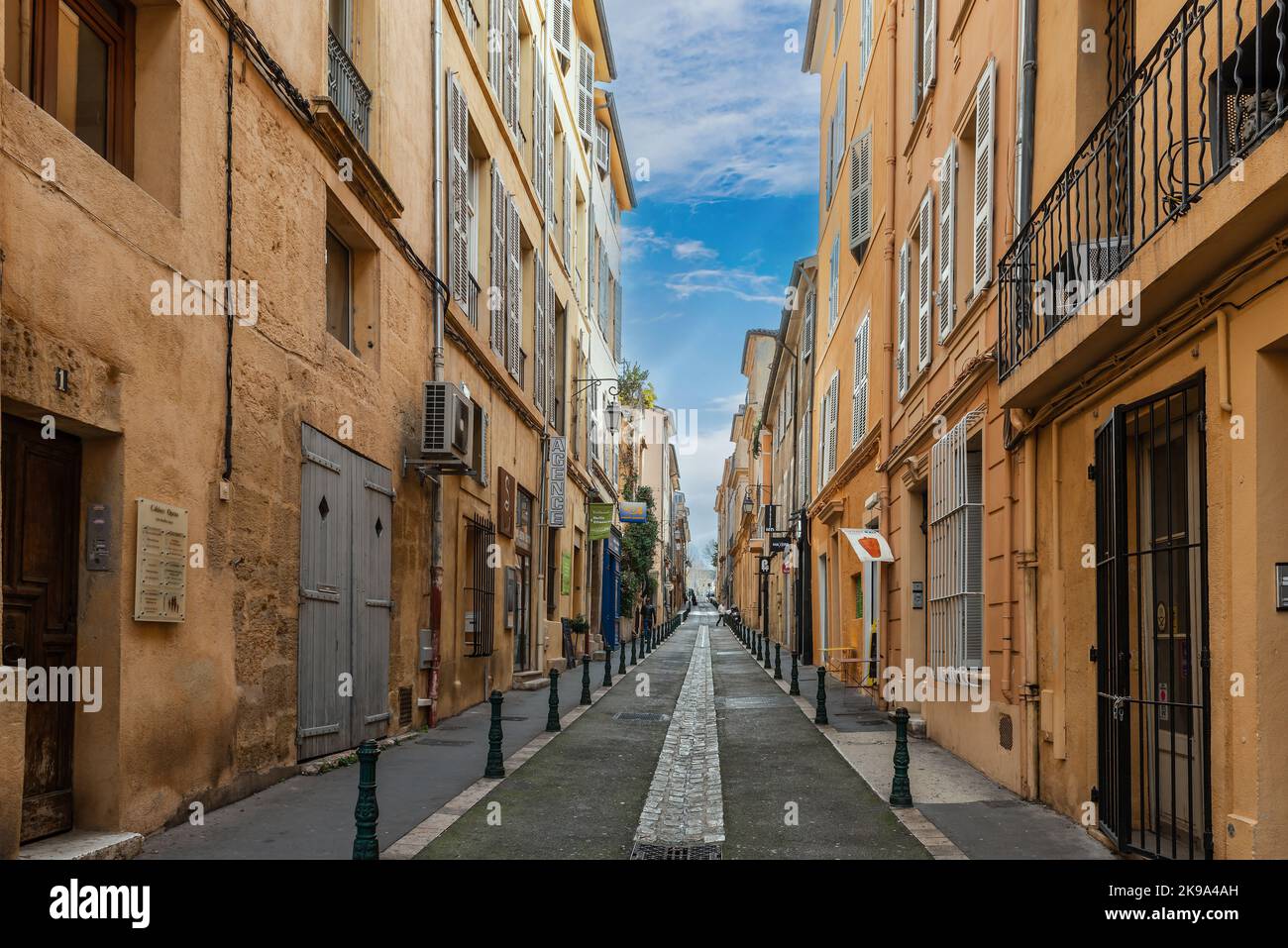 Typical and narrow street of the city of Aix en Provence, in Provence ...