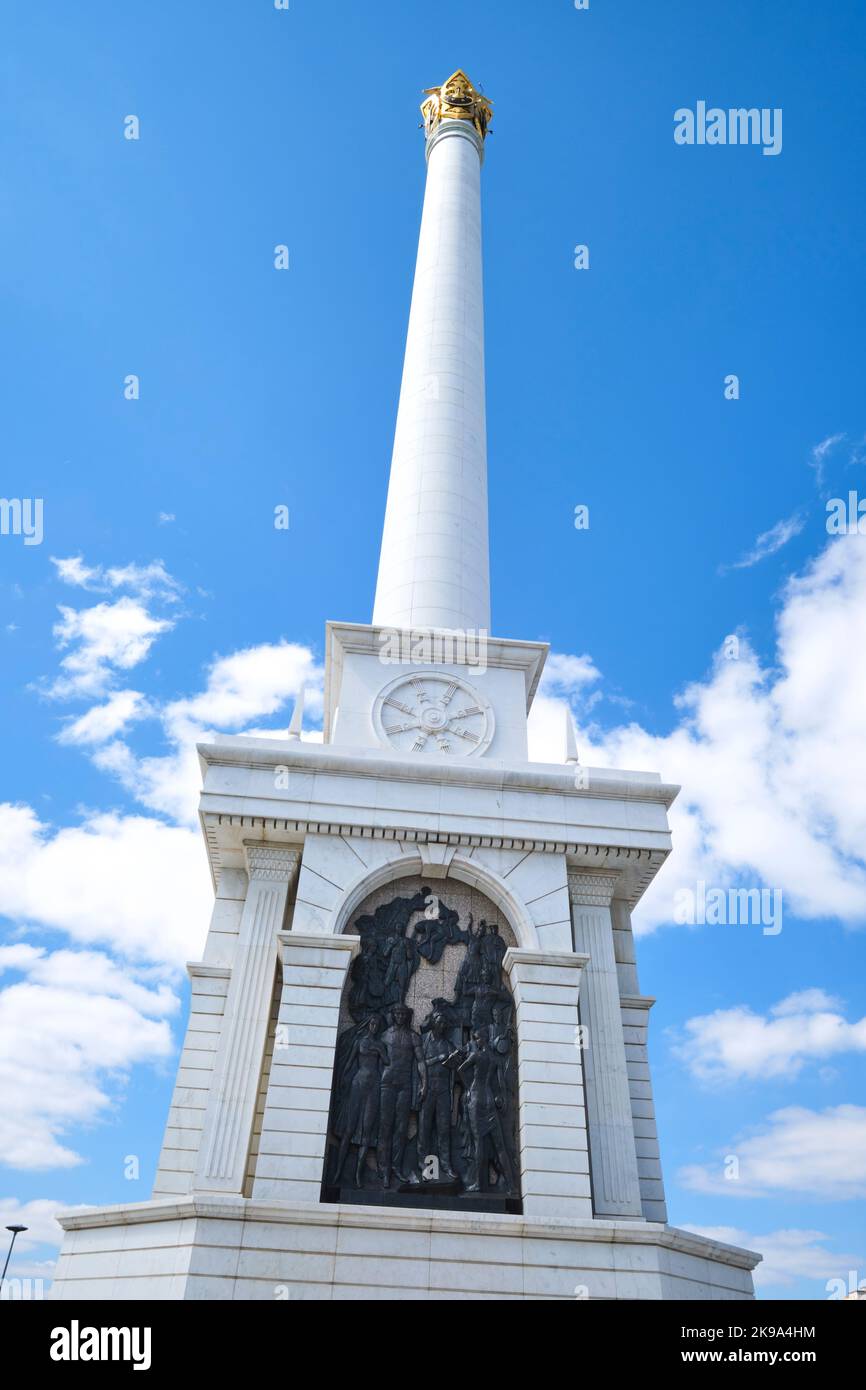 A vertical, looming view of the Independence Monument white column in ...